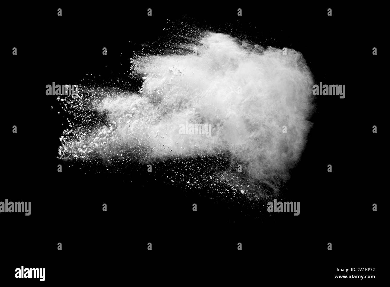White powder explosion isolated on black background. White dust ...