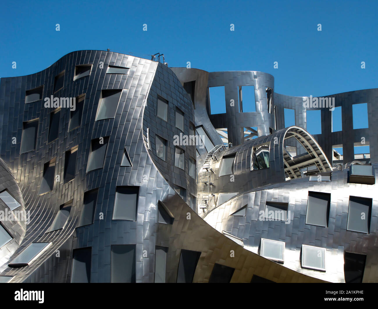 Metal Building With Misshapen Windows Stock Photo - Alamy