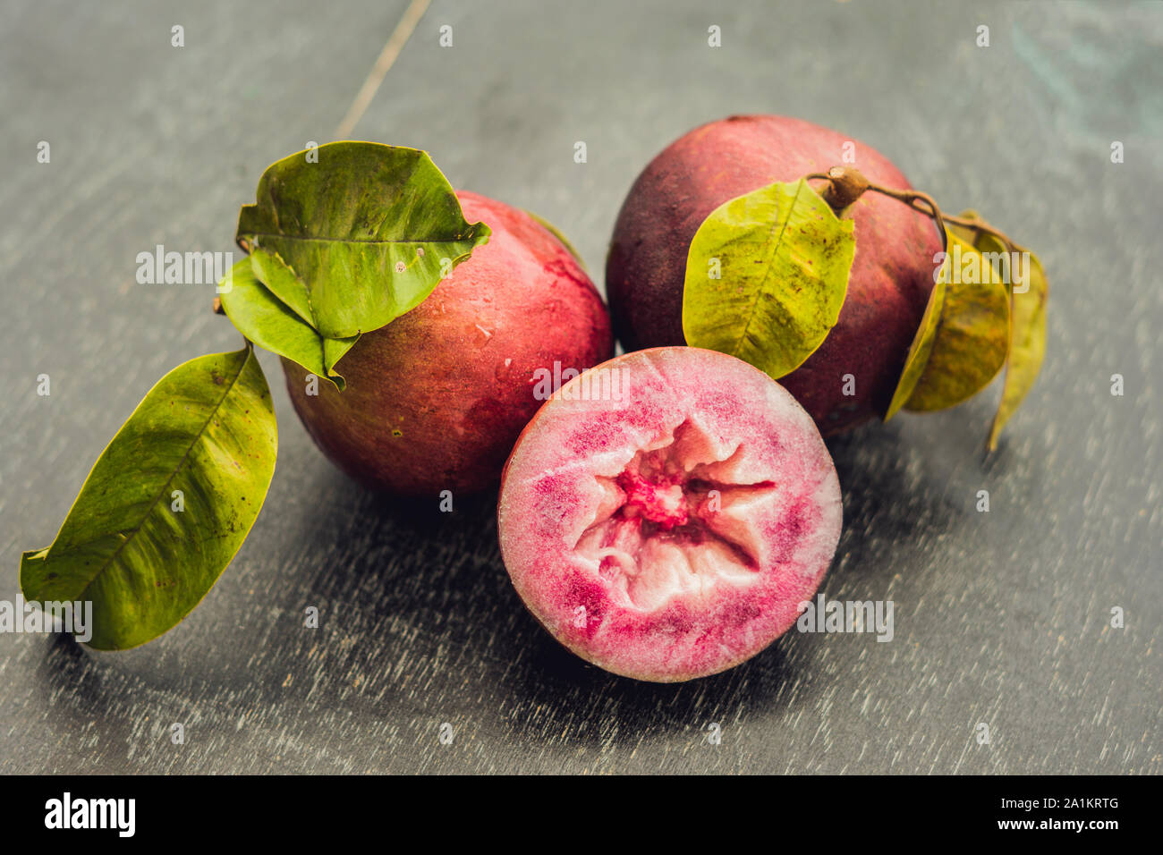 fresh Chrysophyllum cainito fruits on wood background Stock Photo - Alamy