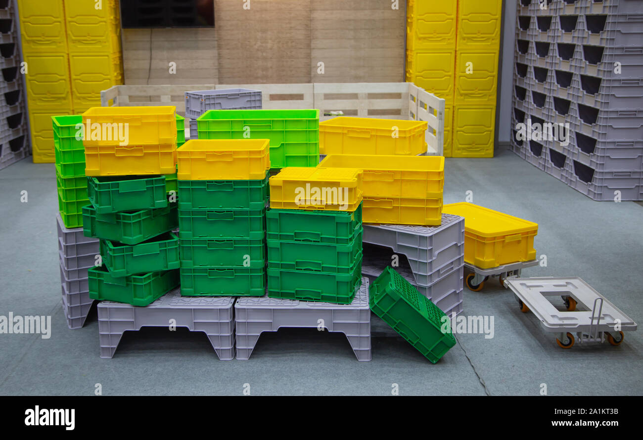 Stack of colorful empty plastic crate container Stock Photo - Alamy