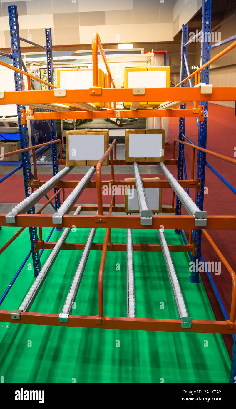 Cardboard parcel gravity flow on racking system in warehouse Stock ...