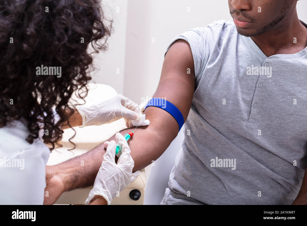 Close-up Of Doctor Taking Blood Sample From Patient's Arm Stock Photo ...