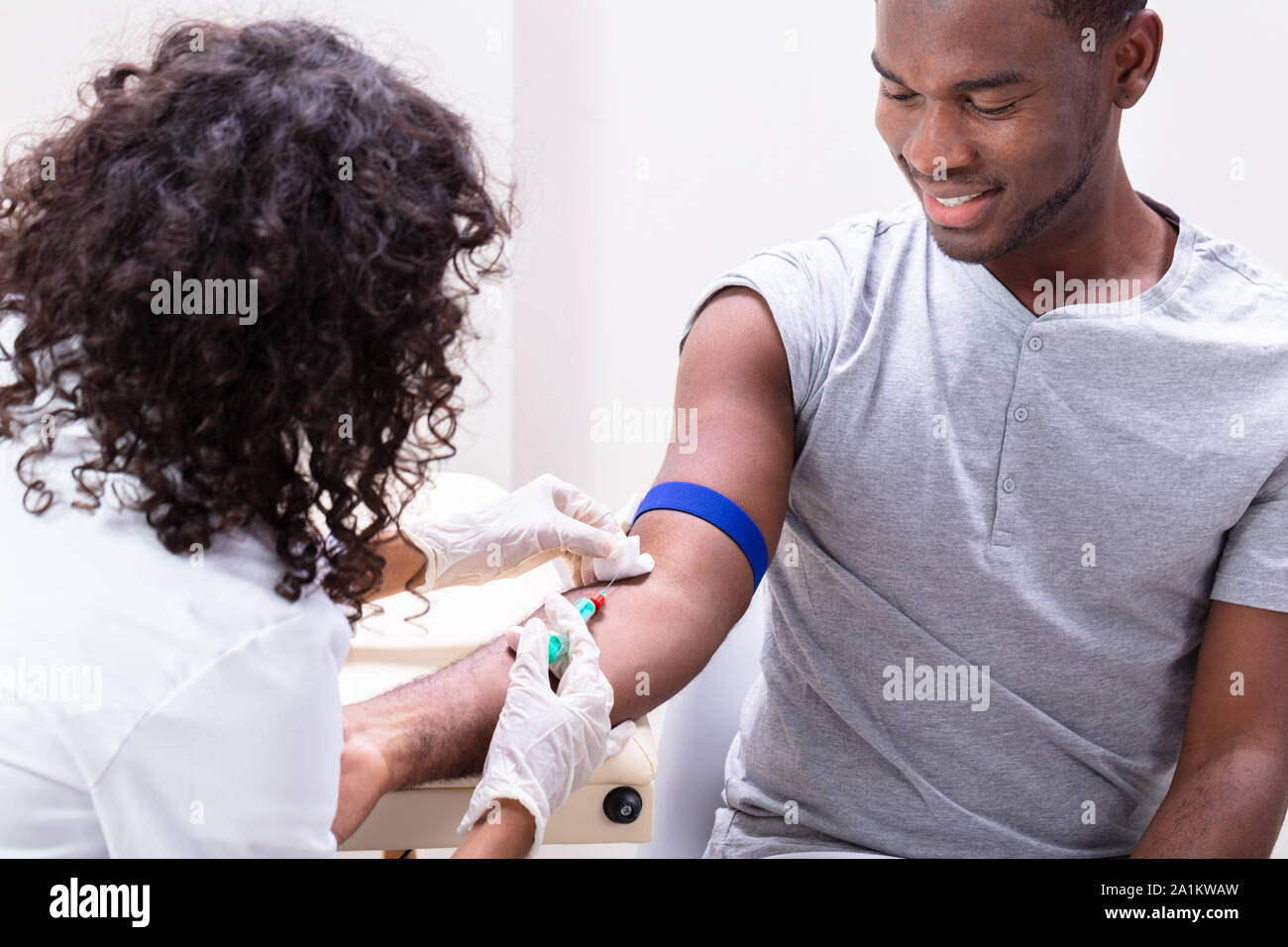 Doctor taking blood hi-res stock photography and images - Alamy