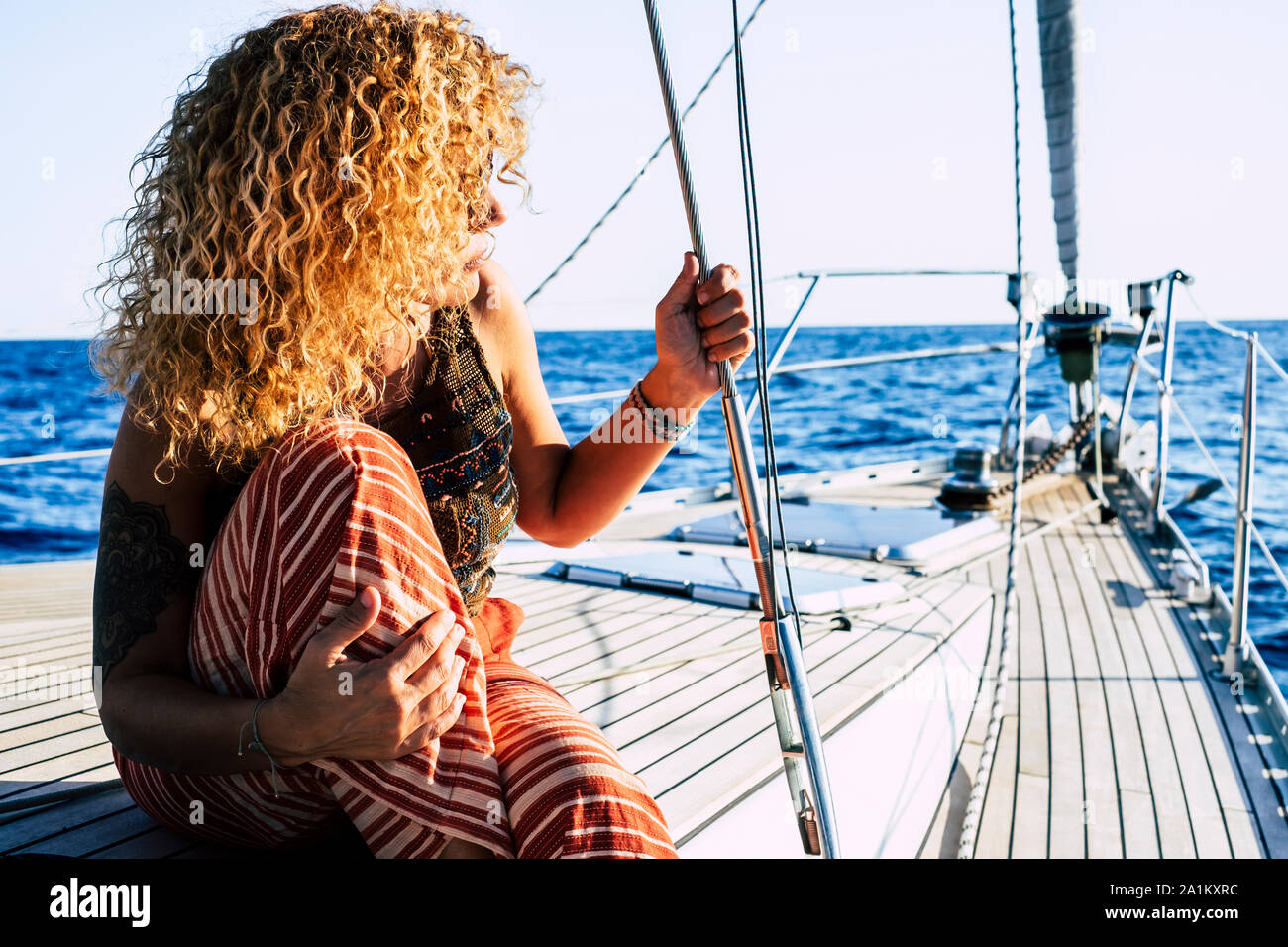 Travel and luxury lifestyle concept wtith beautiful blonde curly ...