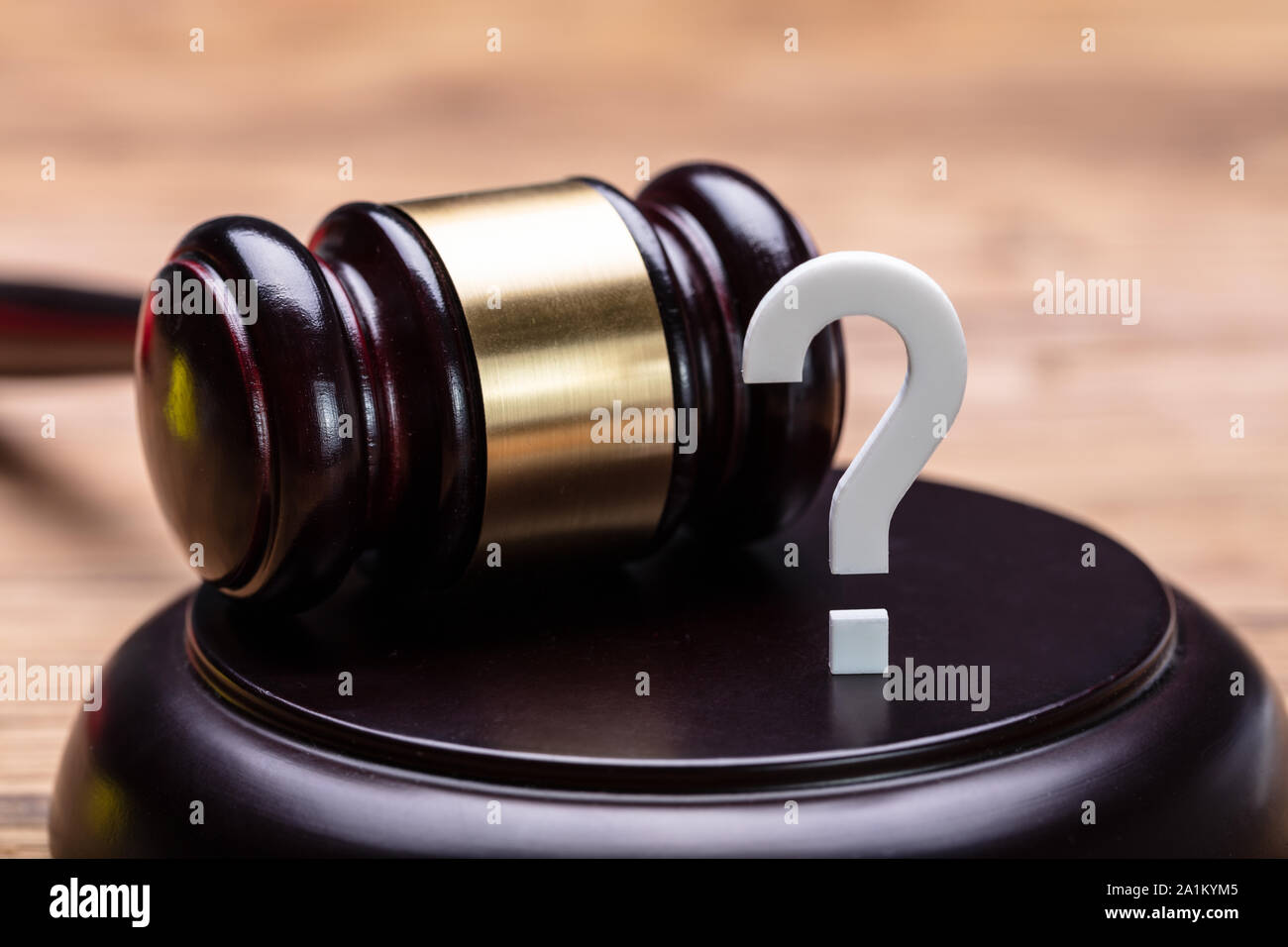 Close-up Of Question Mark Sign With Gavel Over Wooden Desk Stock Photo ...