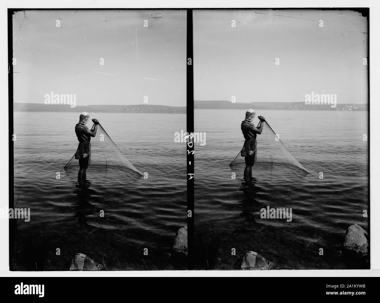 Northern views. Fisherman drawing in his net Stock Photo - Alamy
