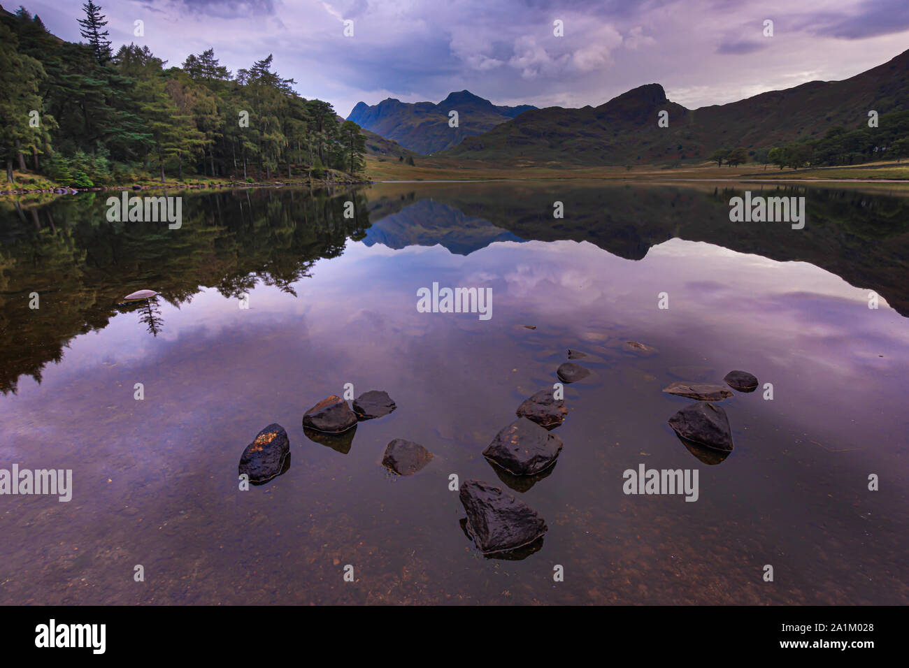 Sunrise at Blea Tarn in English Lake District.Mountains and trees ...