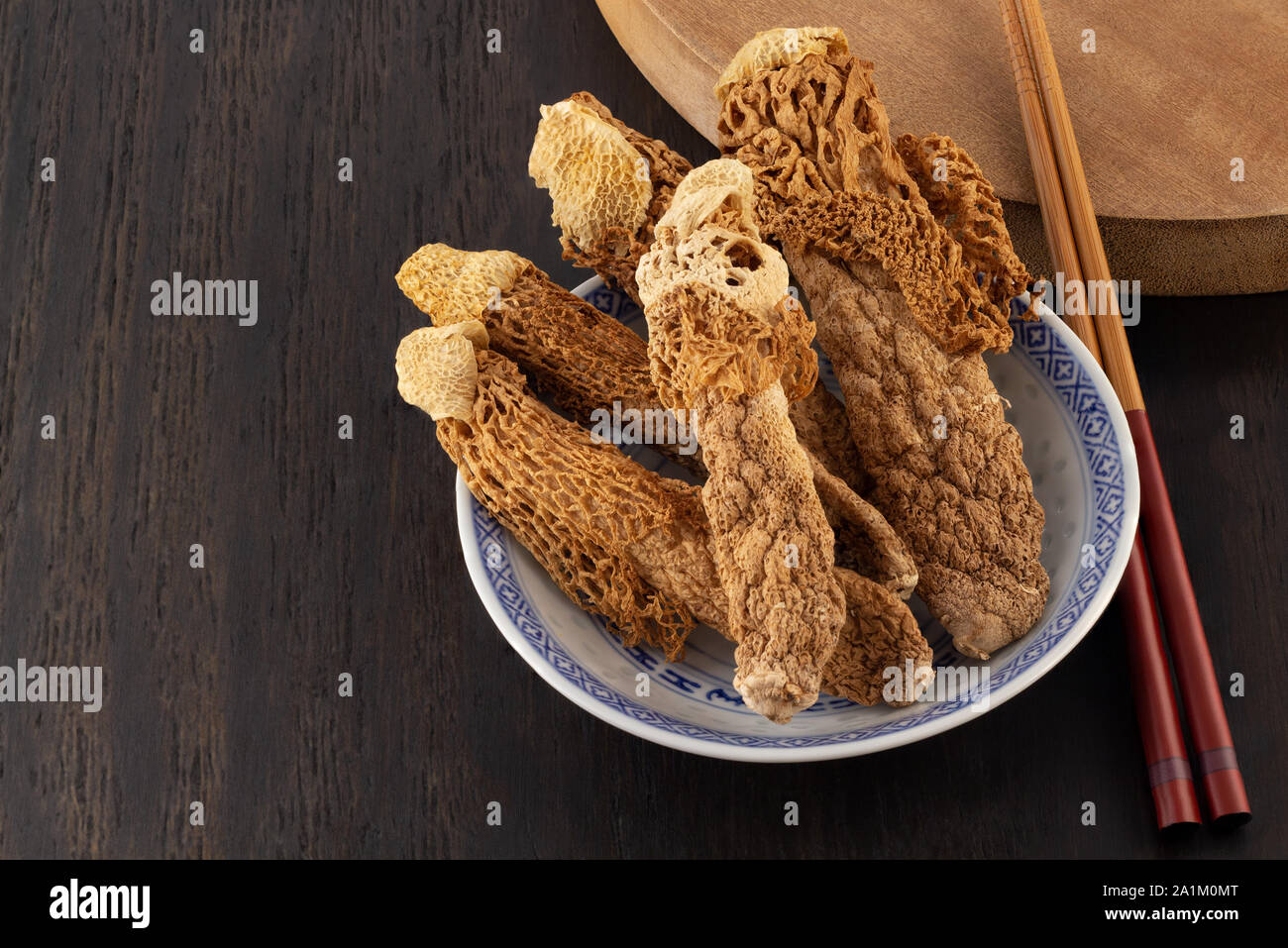 a group of bamboo fungus on wood background Stock Photo - Alamy
