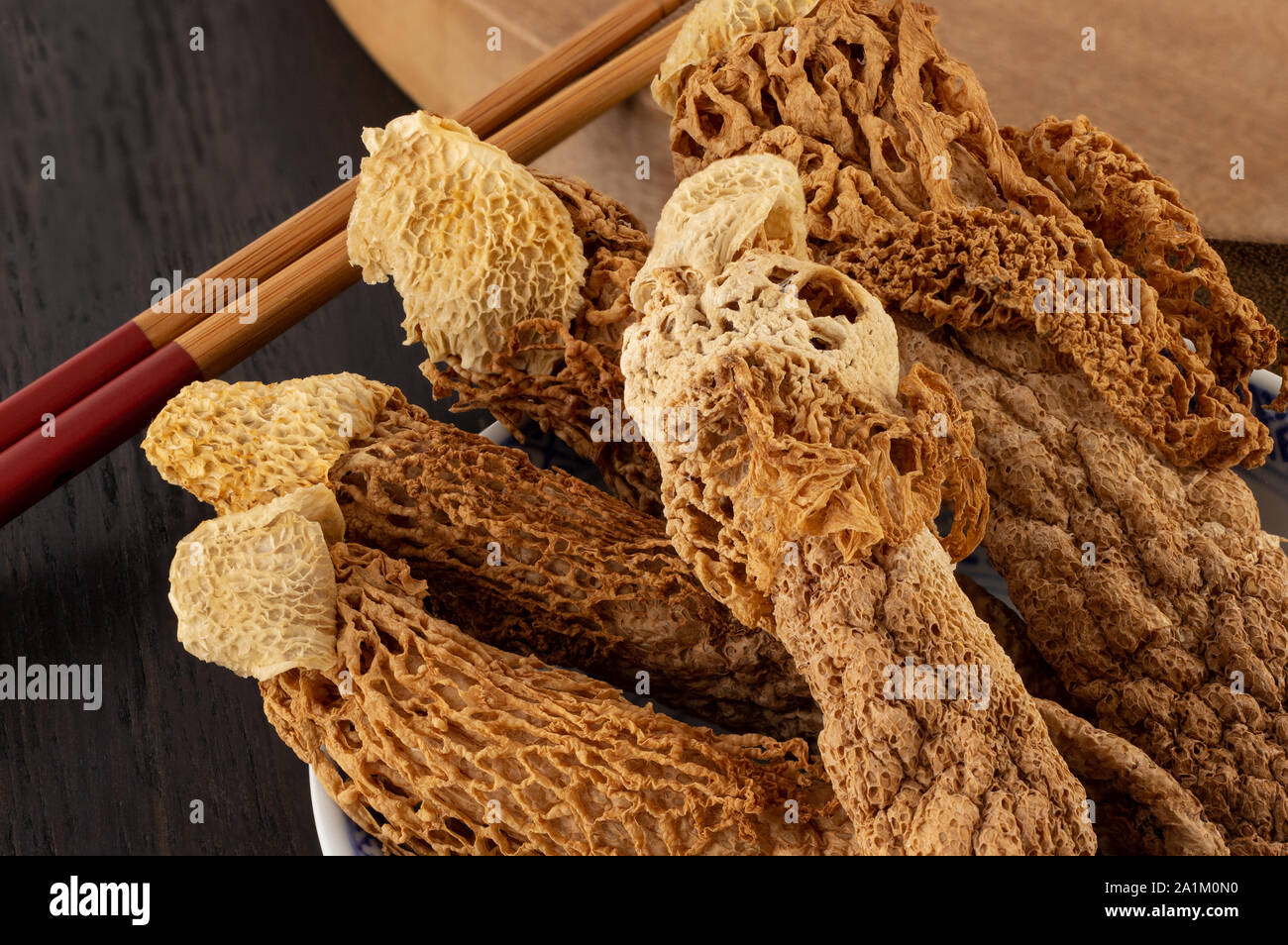 a group of bamboo fungus on wood background Stock Photo - Alamy