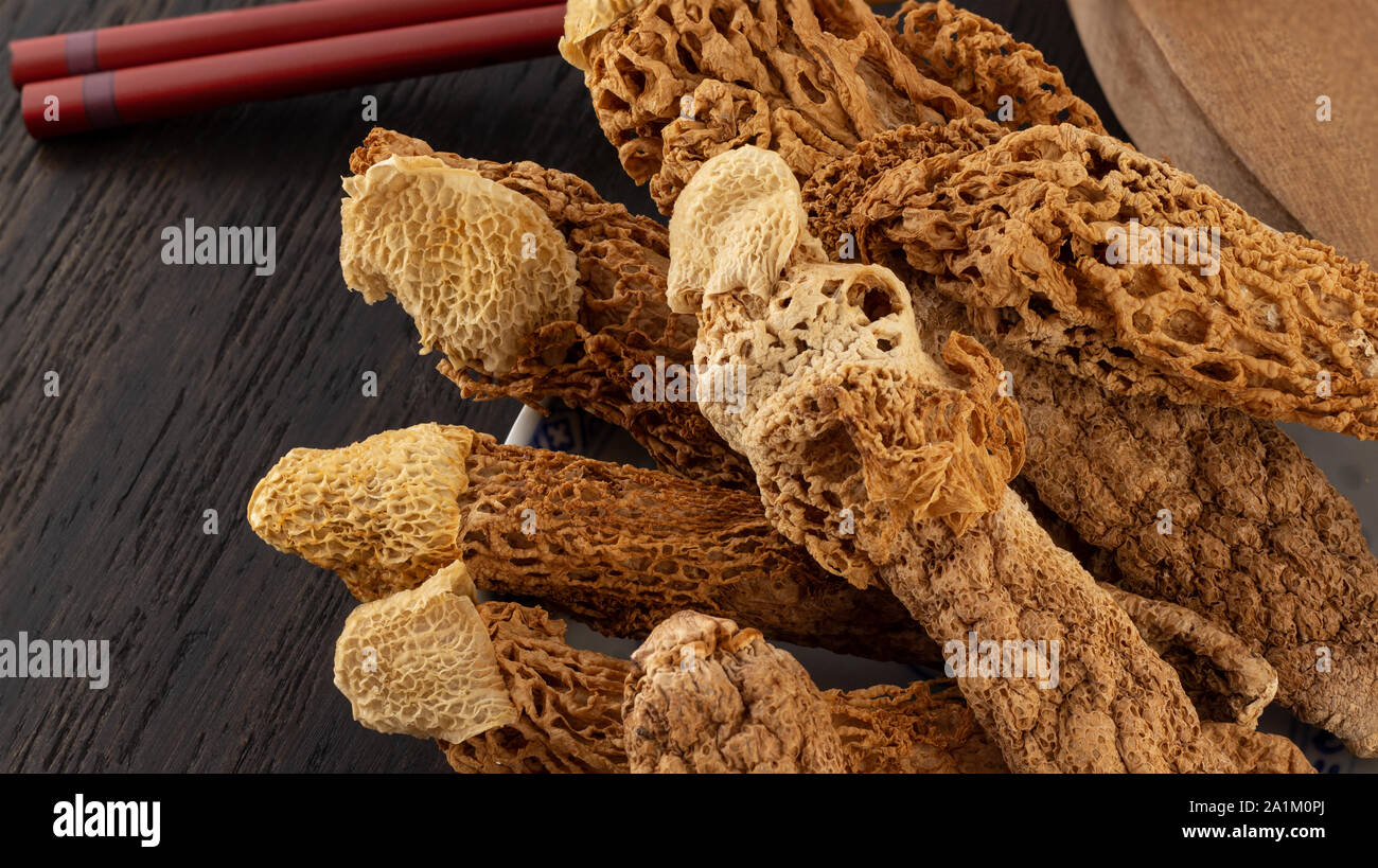 a group of bamboo fungus on wood background Stock Photo - Alamy