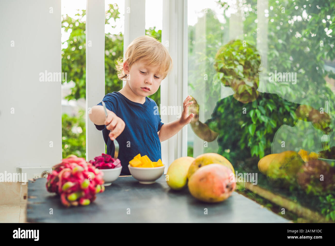 Boy Eating Fruit Salad High Resolution Stock Photography and Images - Alamy