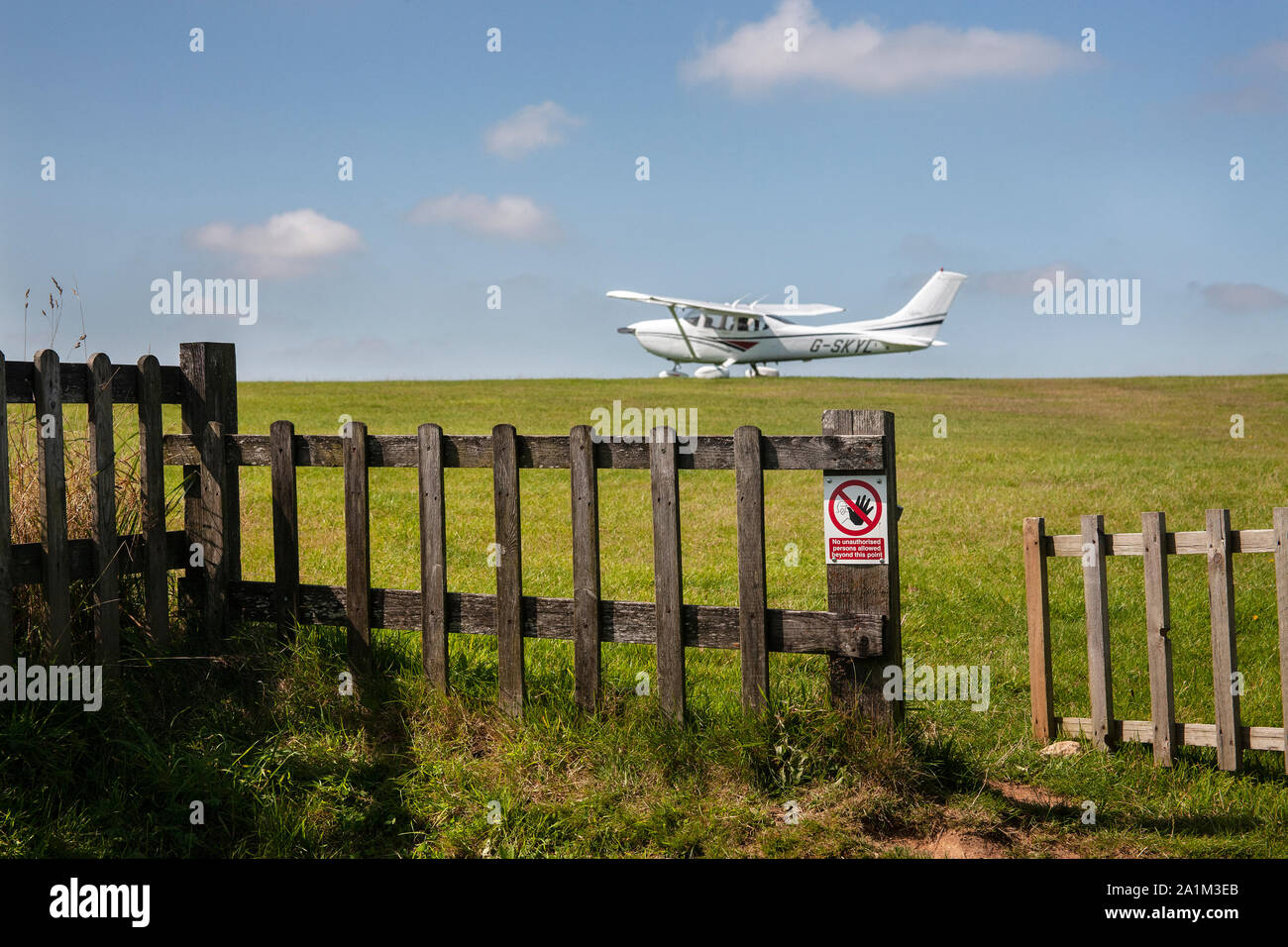 propeller plane on airfield with wooden fence and no entry sign Stock ...
