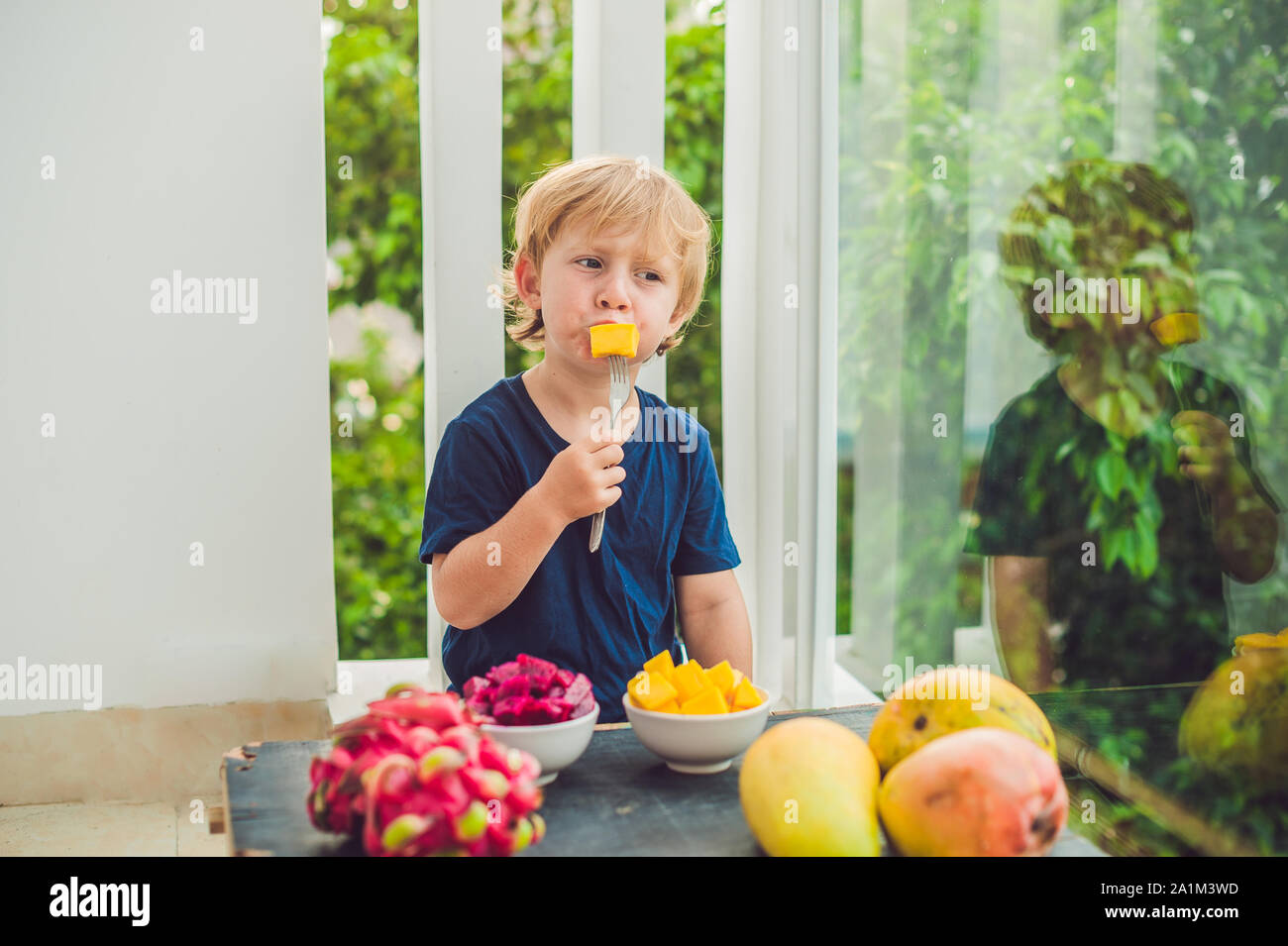 Boy Eating Fruit Salad High Resolution Stock Photography and Images - Alamy