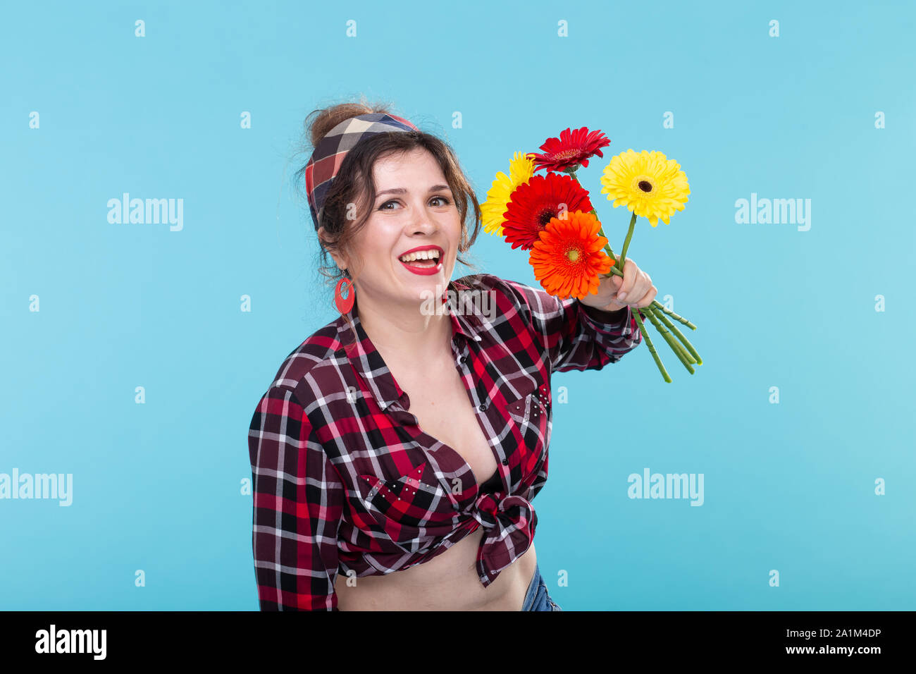 Vintage, fashion and floristic concept - woman with gerberas having fun ...