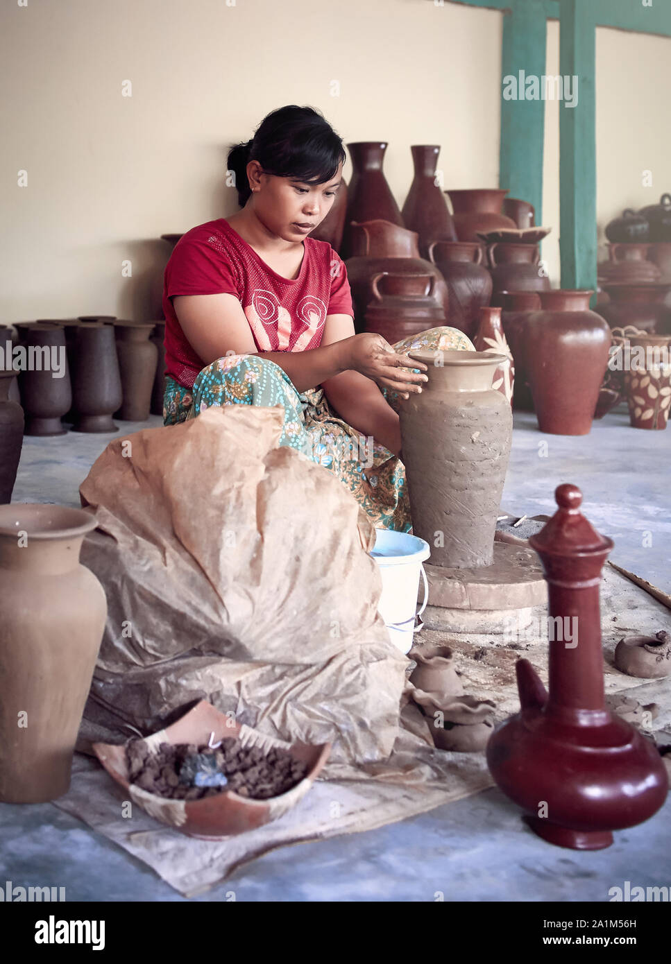 Bali, Indonesia - Sep 23, 2019: Rural asian potter master woman molds ...