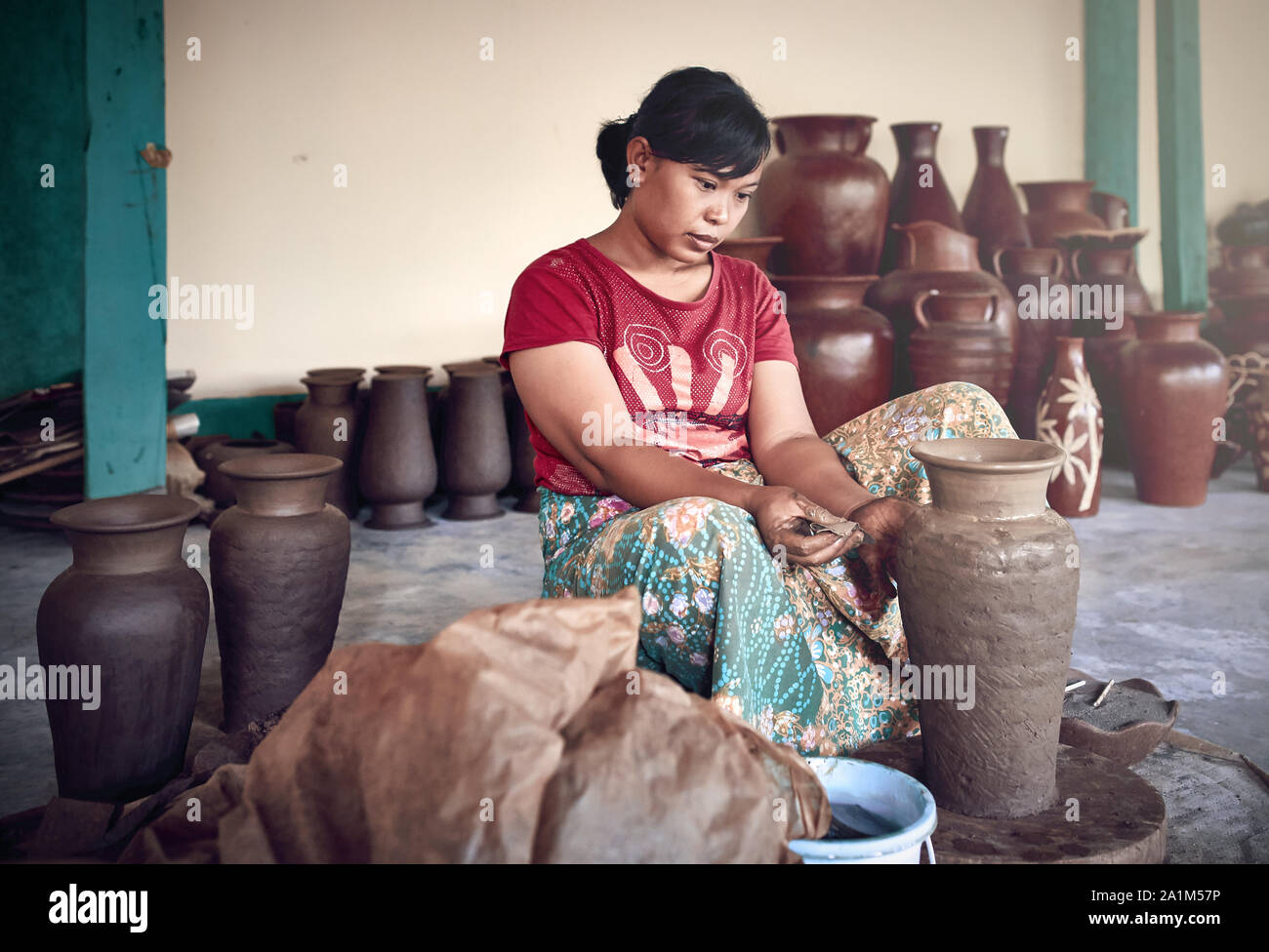 Bali, Indonesia - Sep 23, 2019: Rural asian potter master woman molds ...