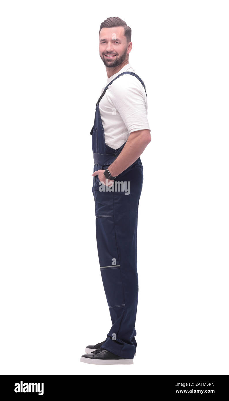 side view. smiling man in blue overalls. isolated on white Stock Photo ...