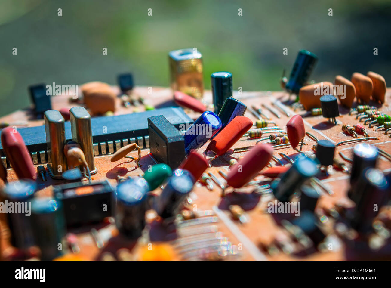 Blurred image of electronic board with capacitors and resistors. Macro ...