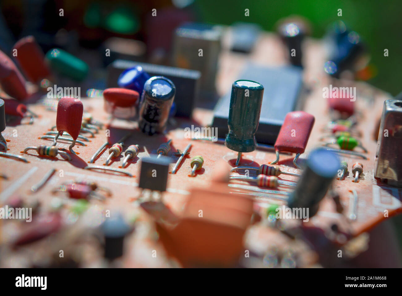 Blurred image of electronic board with capacitors and resistors. Macro ...