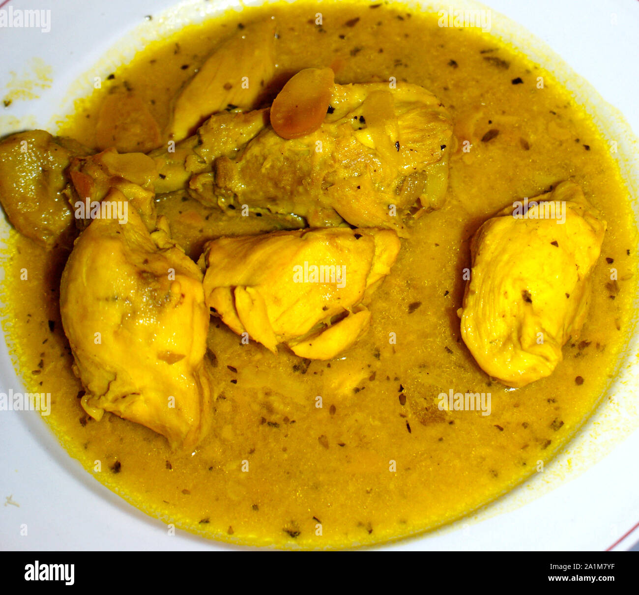 Chicken meat in pepitoria with boiled egg, almonds, onion, wine and ...