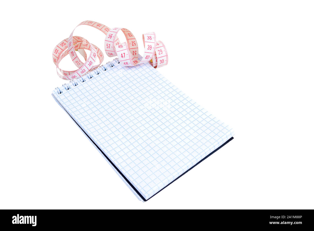 Measuring tape, close-up notebook on a white background Stock Photo - Alamy