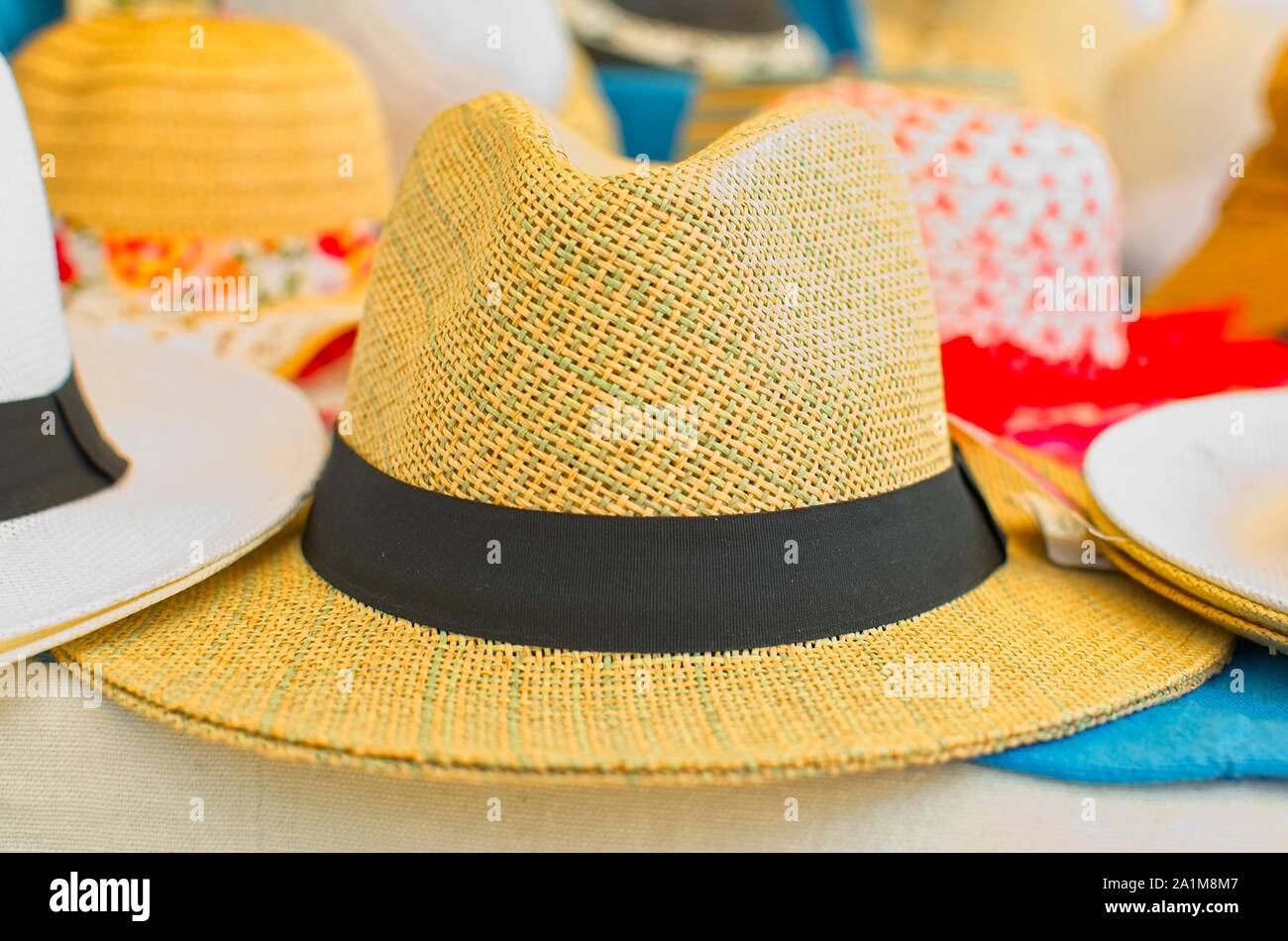 Traditional straw hats in a street market on a sunny morning Stock ...