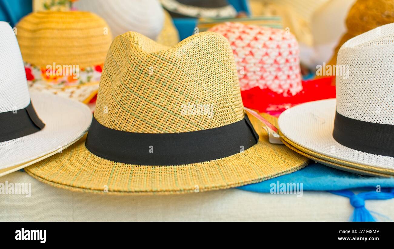 Traditional straw hats in a street market on a sunny morning Stock ...