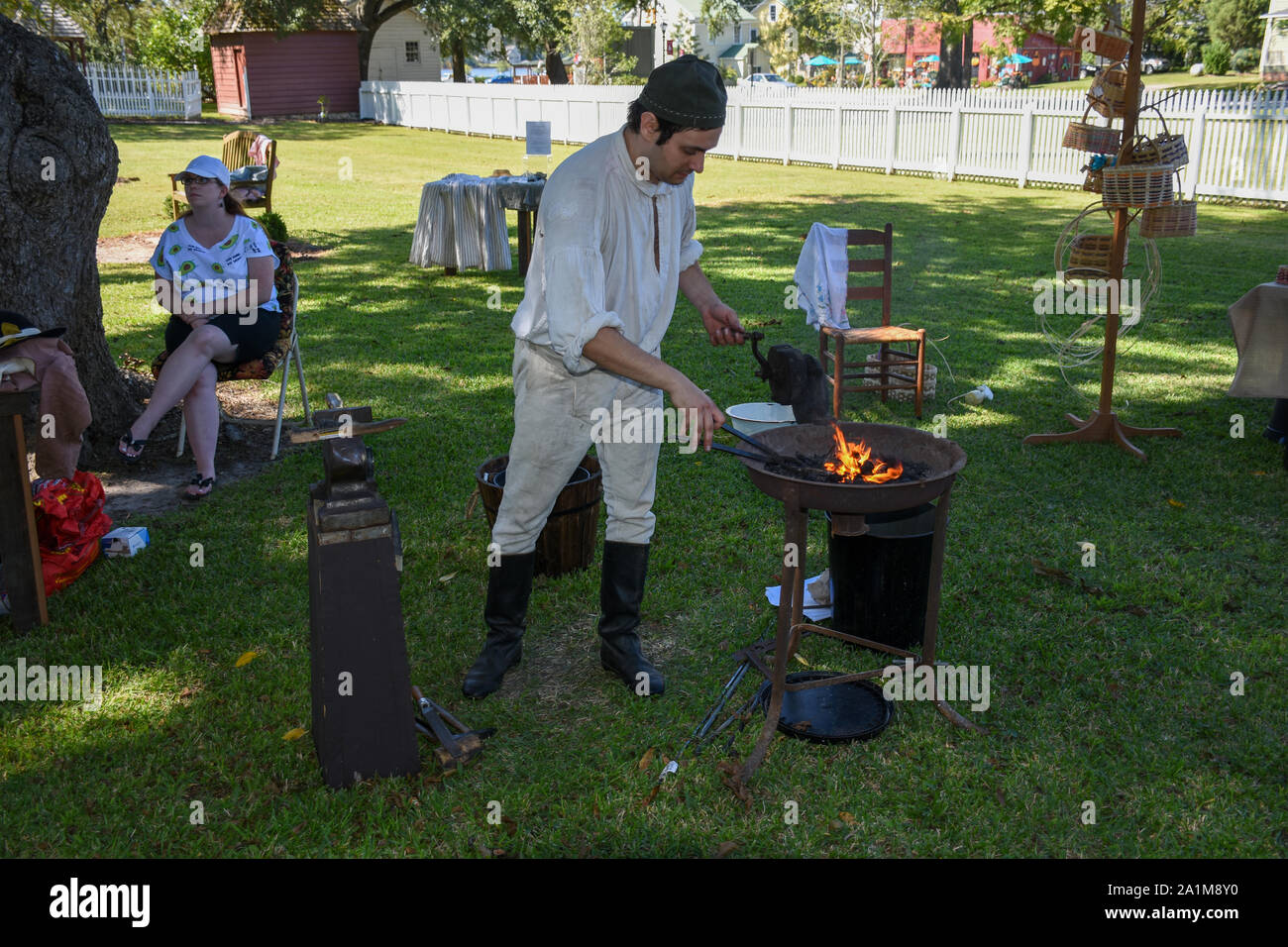 A demonstration of a Blacksmith at work in Colonial times Stock Photo ...