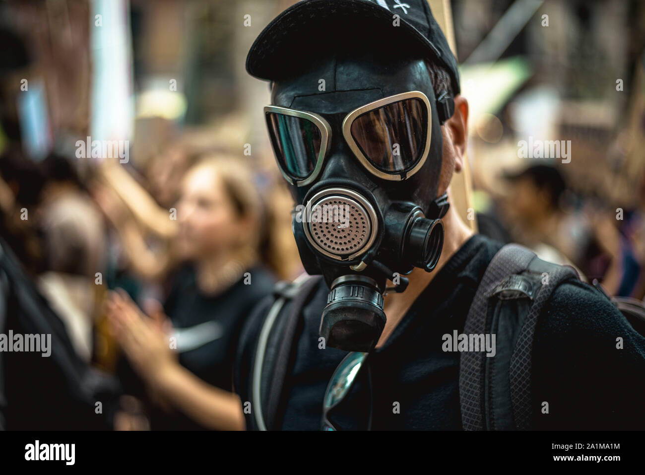 Barcelona, Spain. 27 September, 2019: An activist wears a gas mask as ...