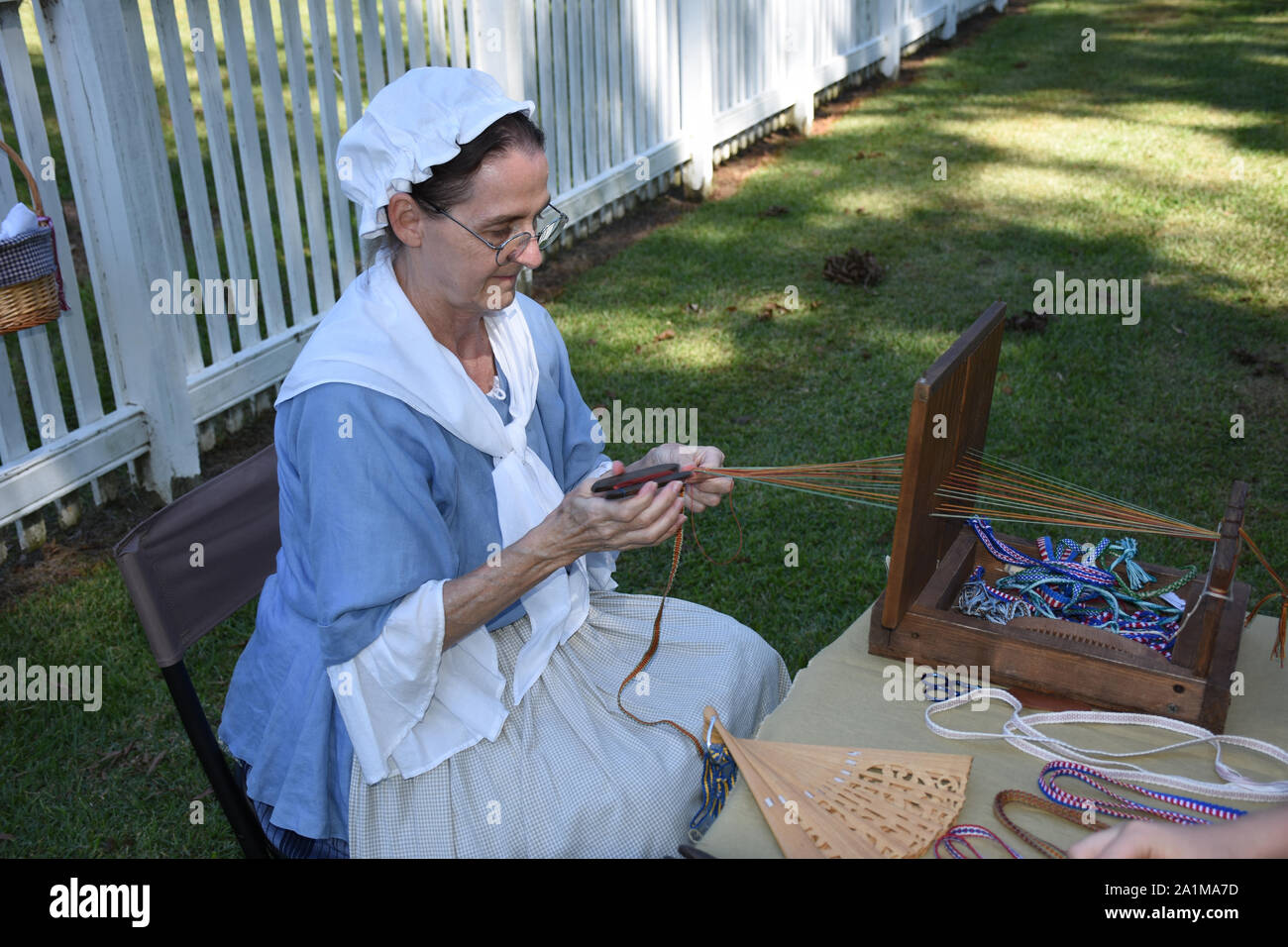 Colonial hand weaving loom demonstration hi-res stock photography and ...