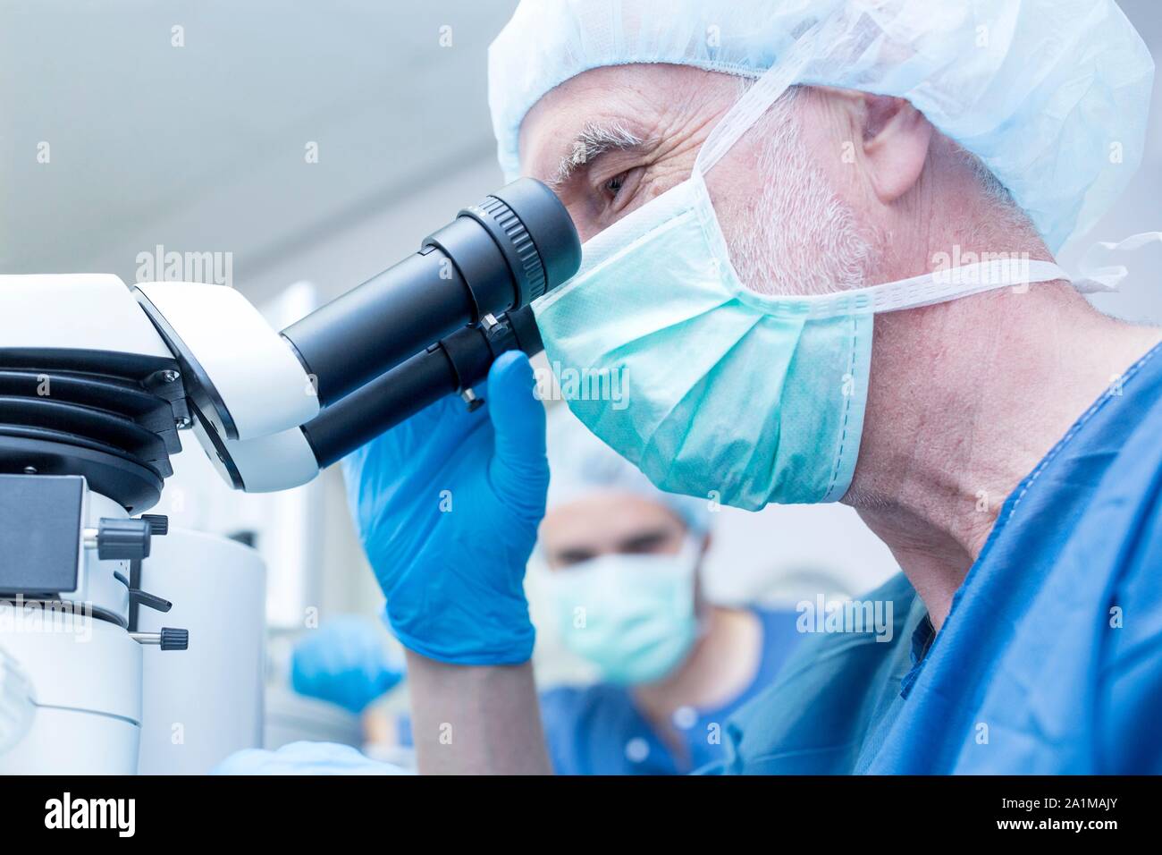 Surgical team performing laser eye surgery Stock Photo - Alamy
