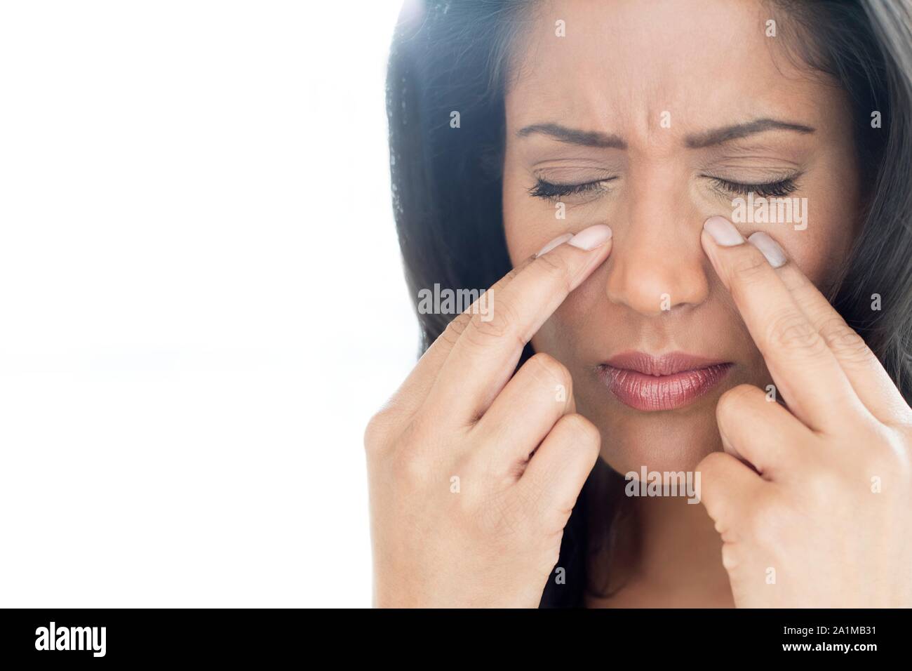 Indian women touching her face hi-res stock photography and images - Alamy