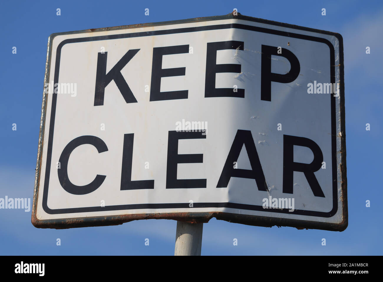 Keep clear road sign in blue sky background, horizontal Stock Photo - Alamy