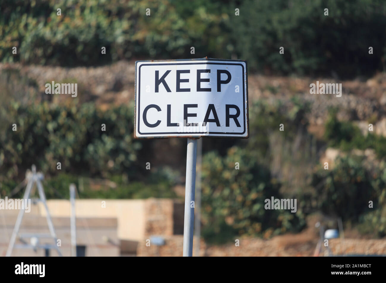 Keep clear road sign on blur background, horizontal Stock Photo - Alamy