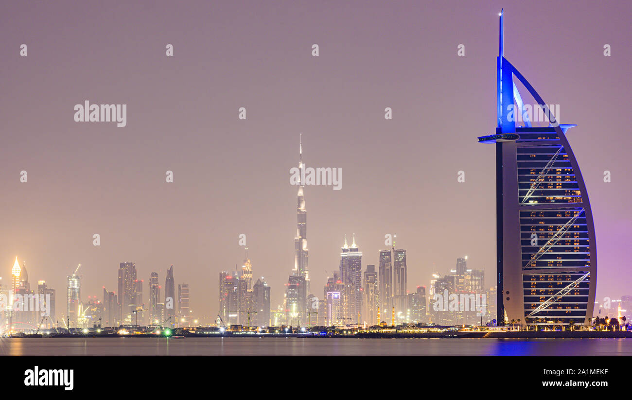 Illuminated Dubai skyline with the Burj Khalifa and the Burj Al Arab ...