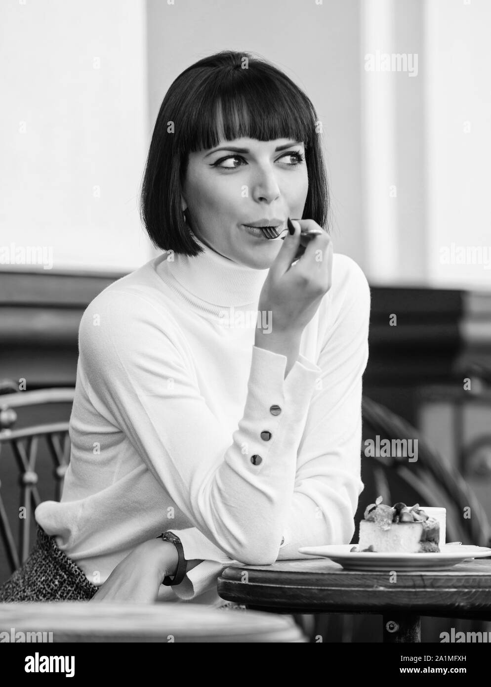 Woman attractive elegant brunette eat gourmet cake cafe terrace ...