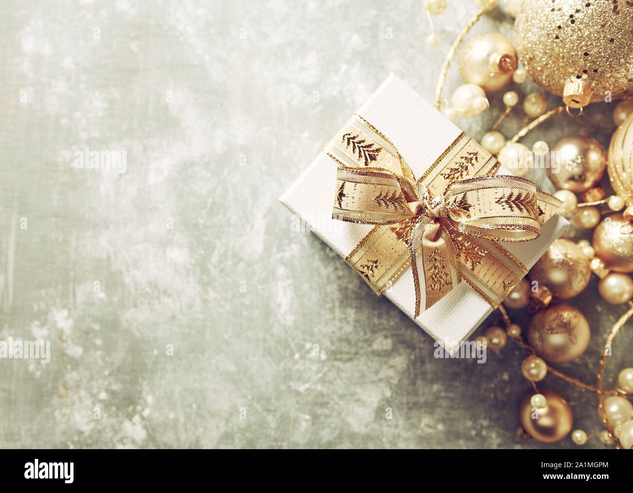 Christmas Present with Gold Ribbon and Gold Christmas Decorations ...
