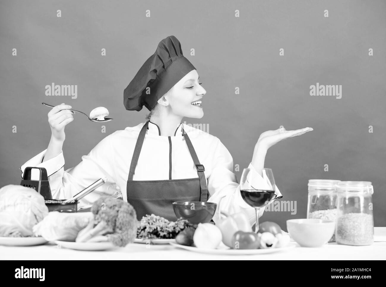 Cooking meal. Woman chef try taste eat food. Delicious recipe concept ...