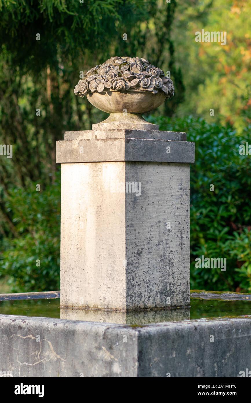 Old stone fountain with flowers hi-res stock photography and images - Alamy