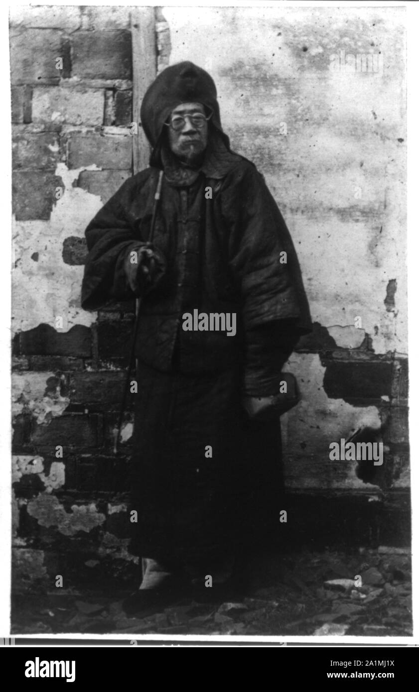 Old man in spectacles Summary: Photograph shows an elderly Chinese man ...