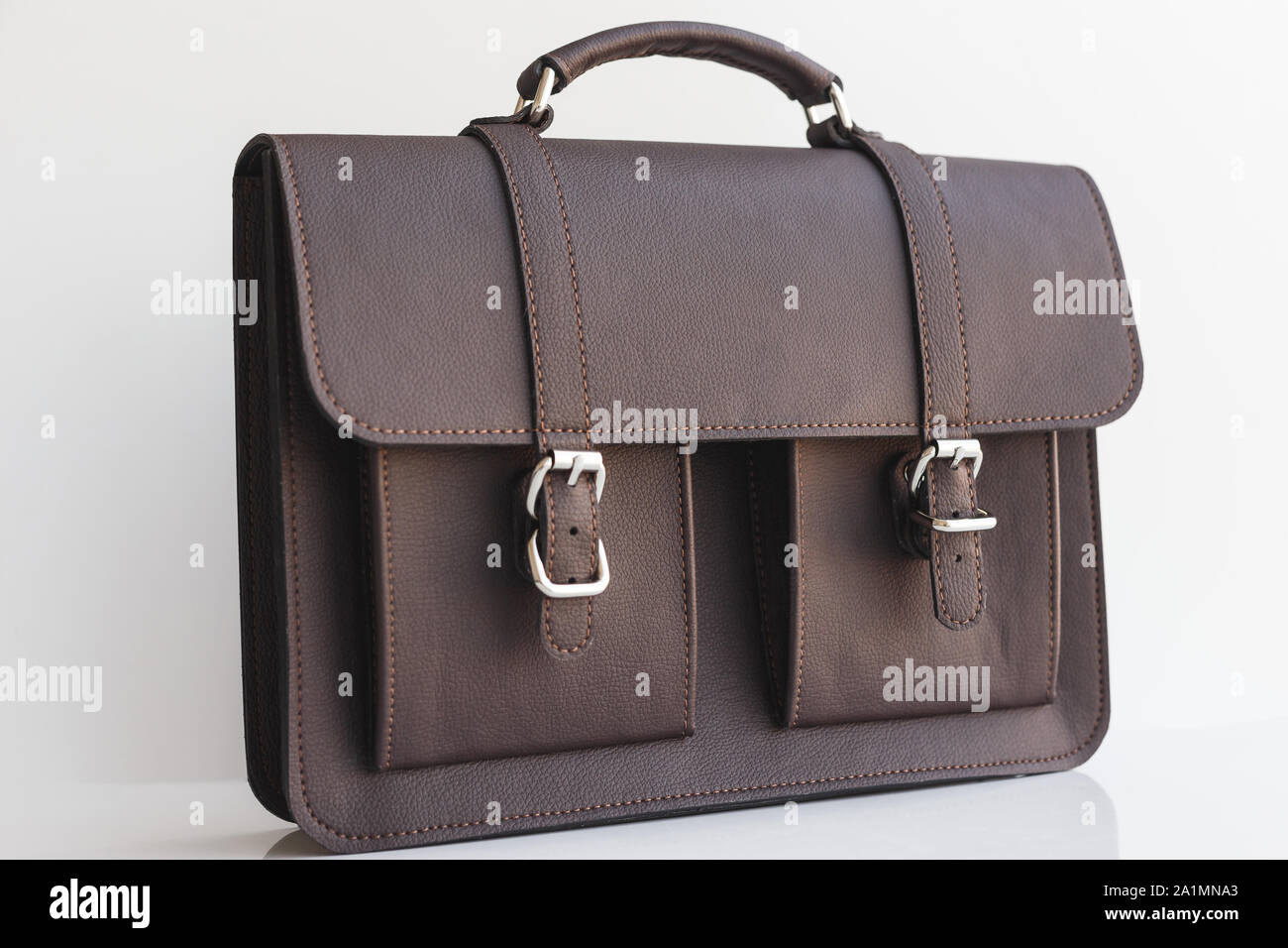 Brown genuine leather unisex office bag on white background Stock Photo ...