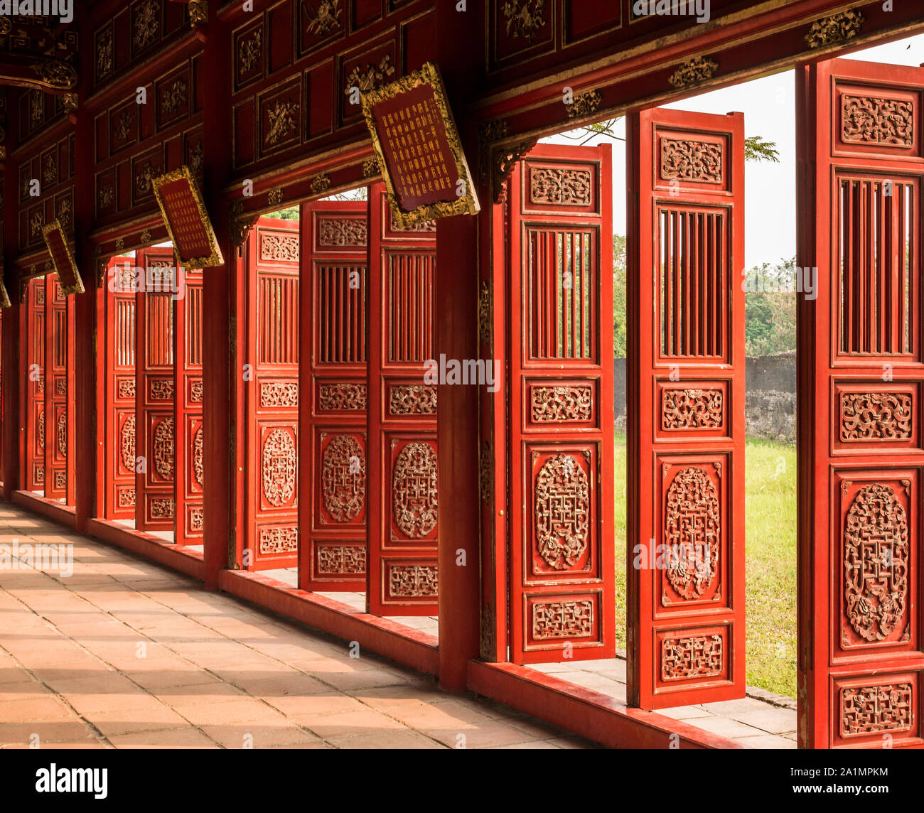 Decorated red doors of corridor at Imperial City of Hue, Vietnam ...