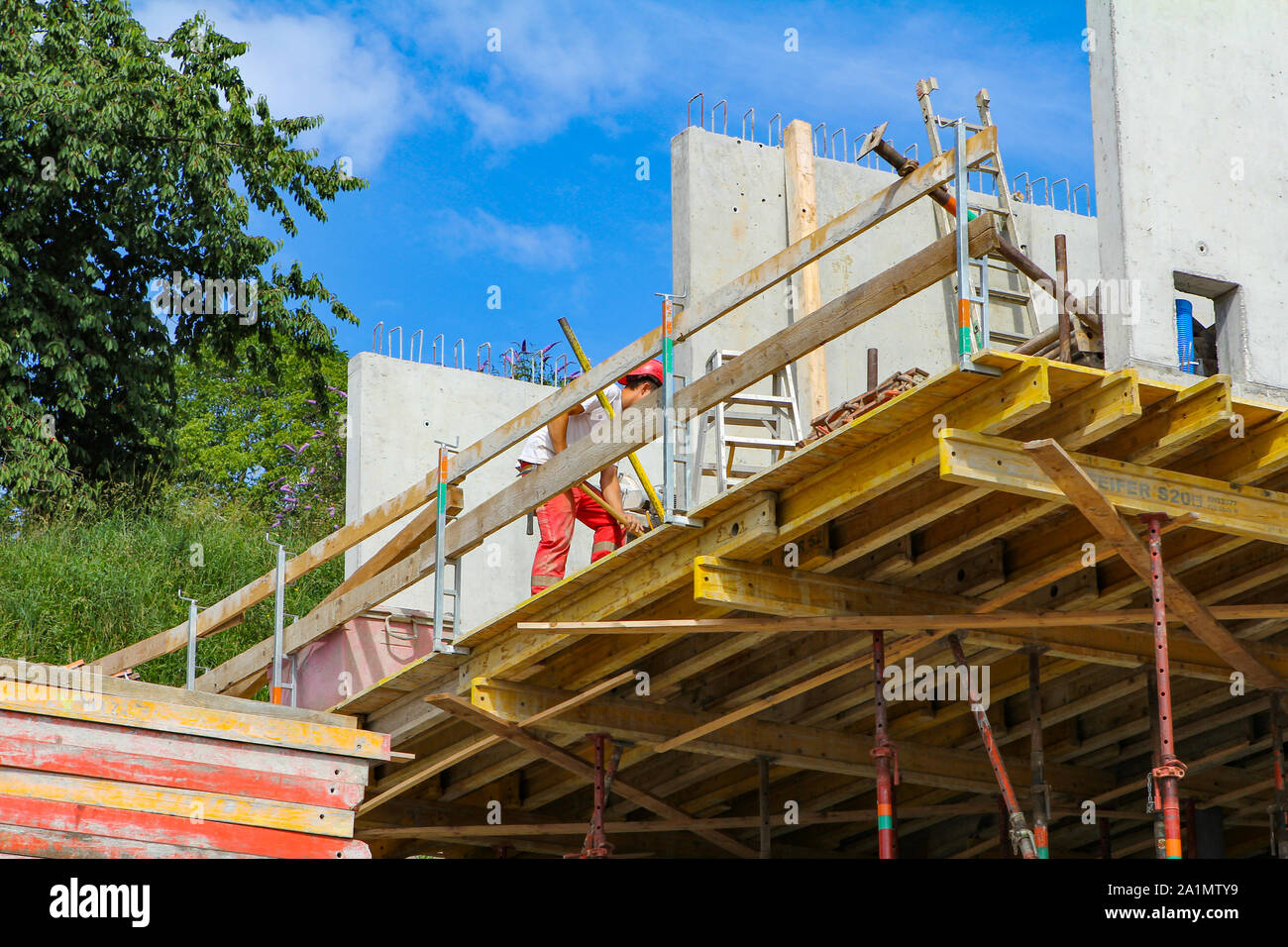 Hard working people at construction site Stock Photo - Alamy