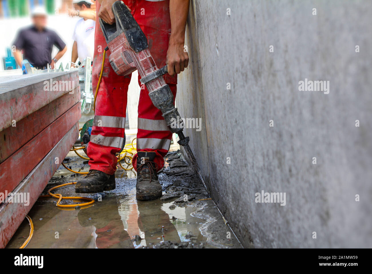 Hard working people at construction site Stock Photo - Alamy