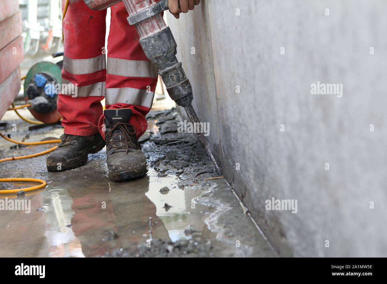 Hard working people at construction site Stock Photo - Alamy