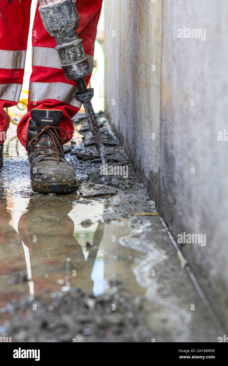Hard working people at construction site Stock Photo - Alamy