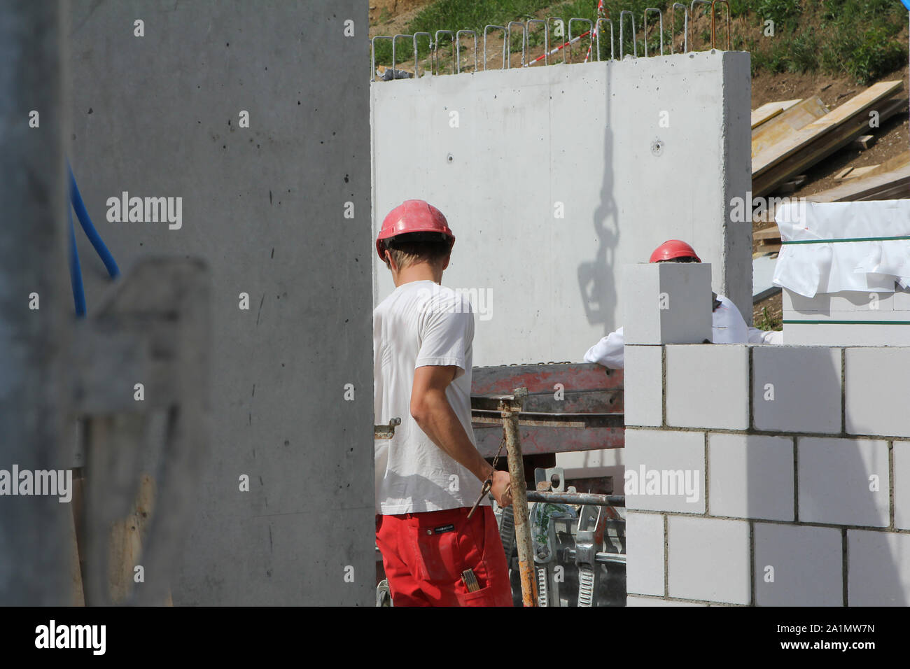 Hard working people at construction site Stock Photo - Alamy