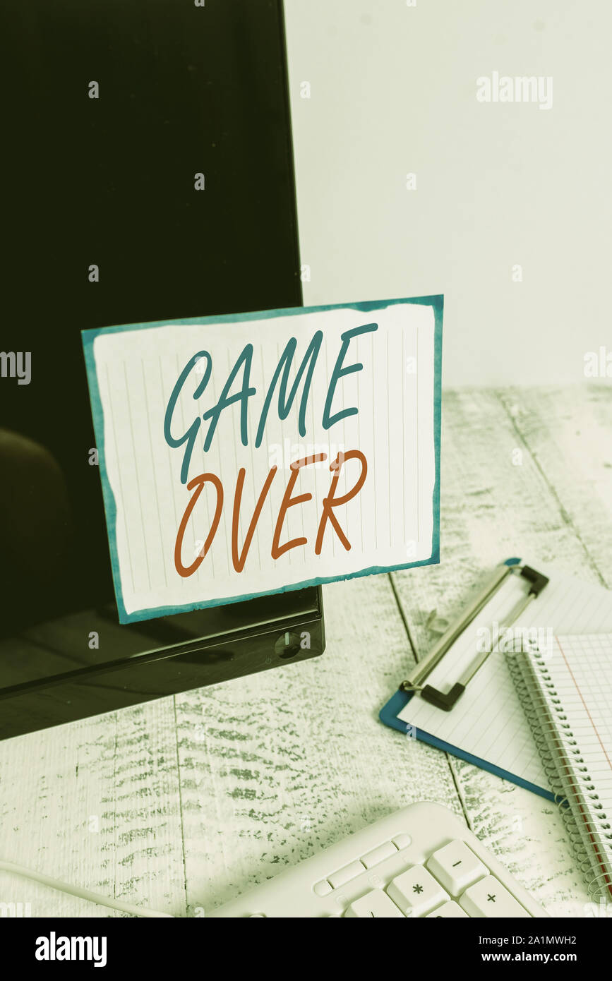 Writing note showing Game Over. Business concept for A situation in a ...