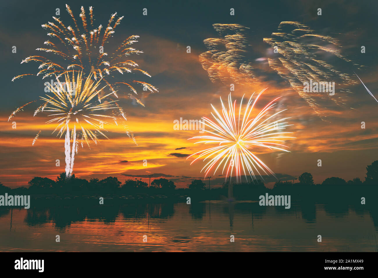 Fireworks display on majestic beautiful sky sunset lake Stock Photo - Alamy