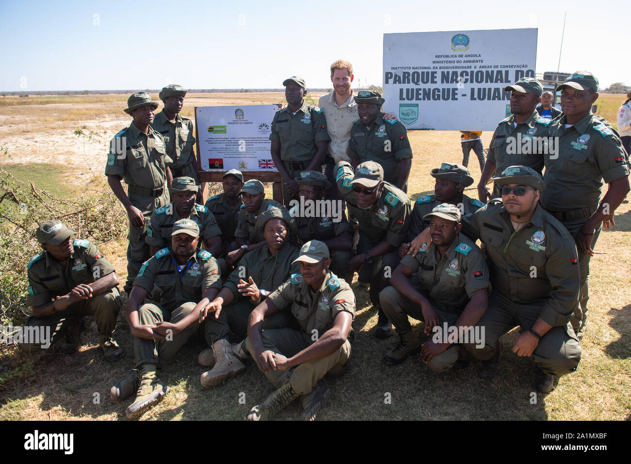 The Duke of Sussex poses for a photo with park rangers at a Queen's ...